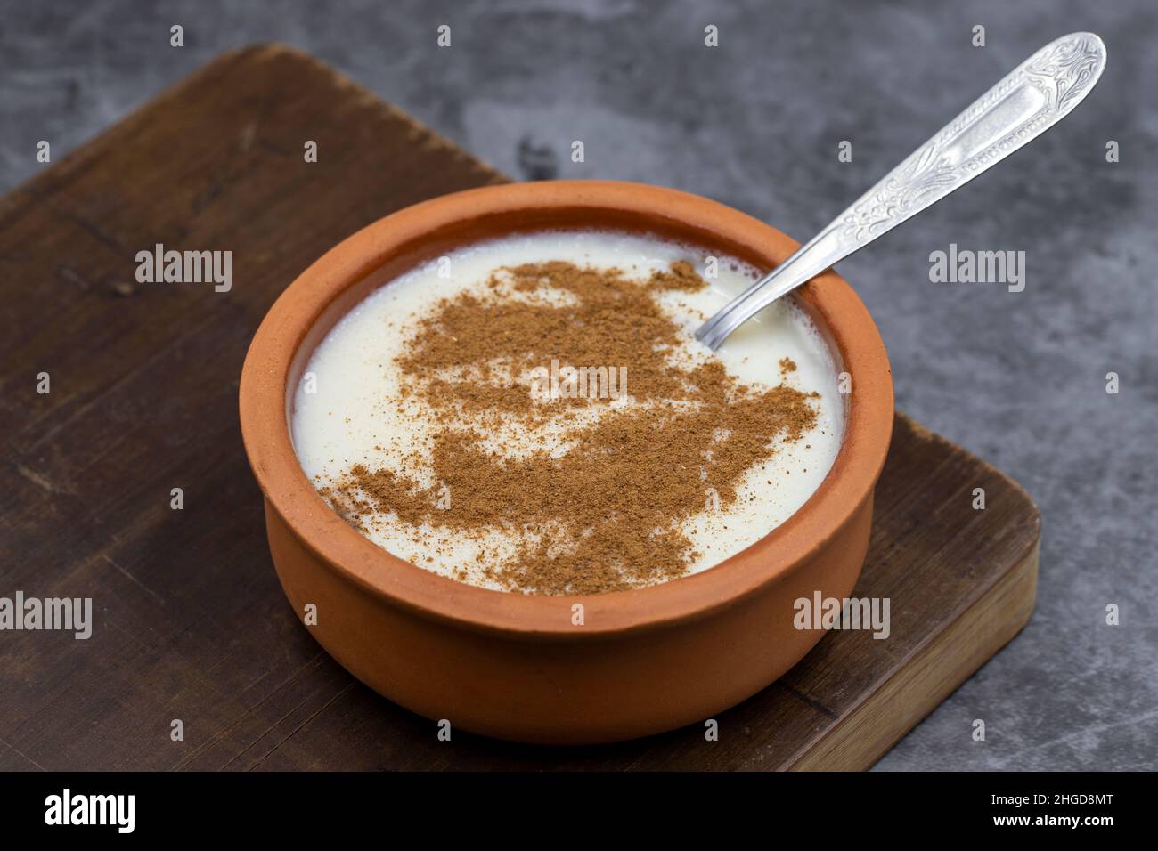 Rice pudding (Sutlac). Turkish cuisine flavor rice pudding on a dark ...