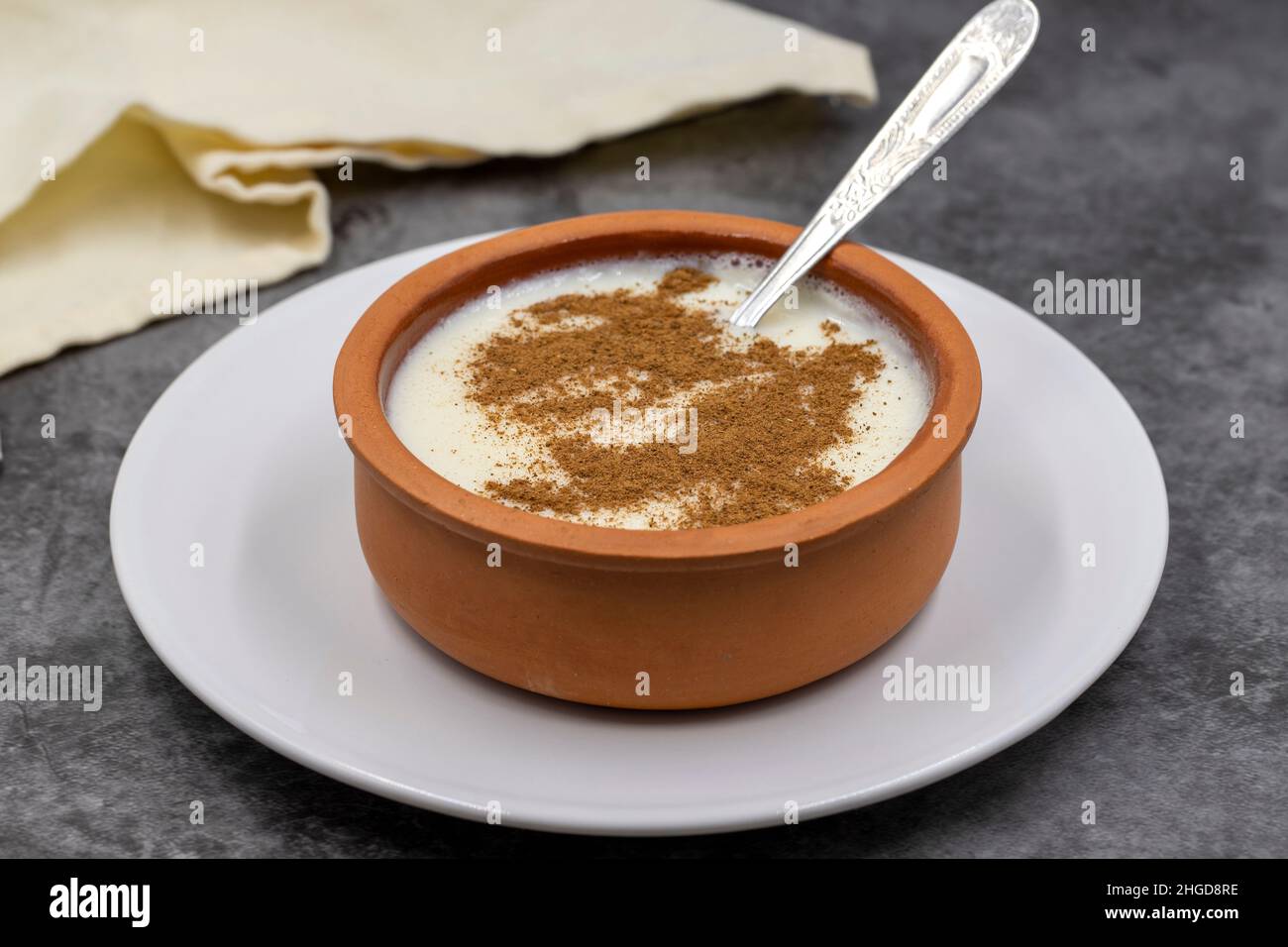 Rice pudding (Sutlac). Turkish cuisine flavor rice pudding on a dark ...