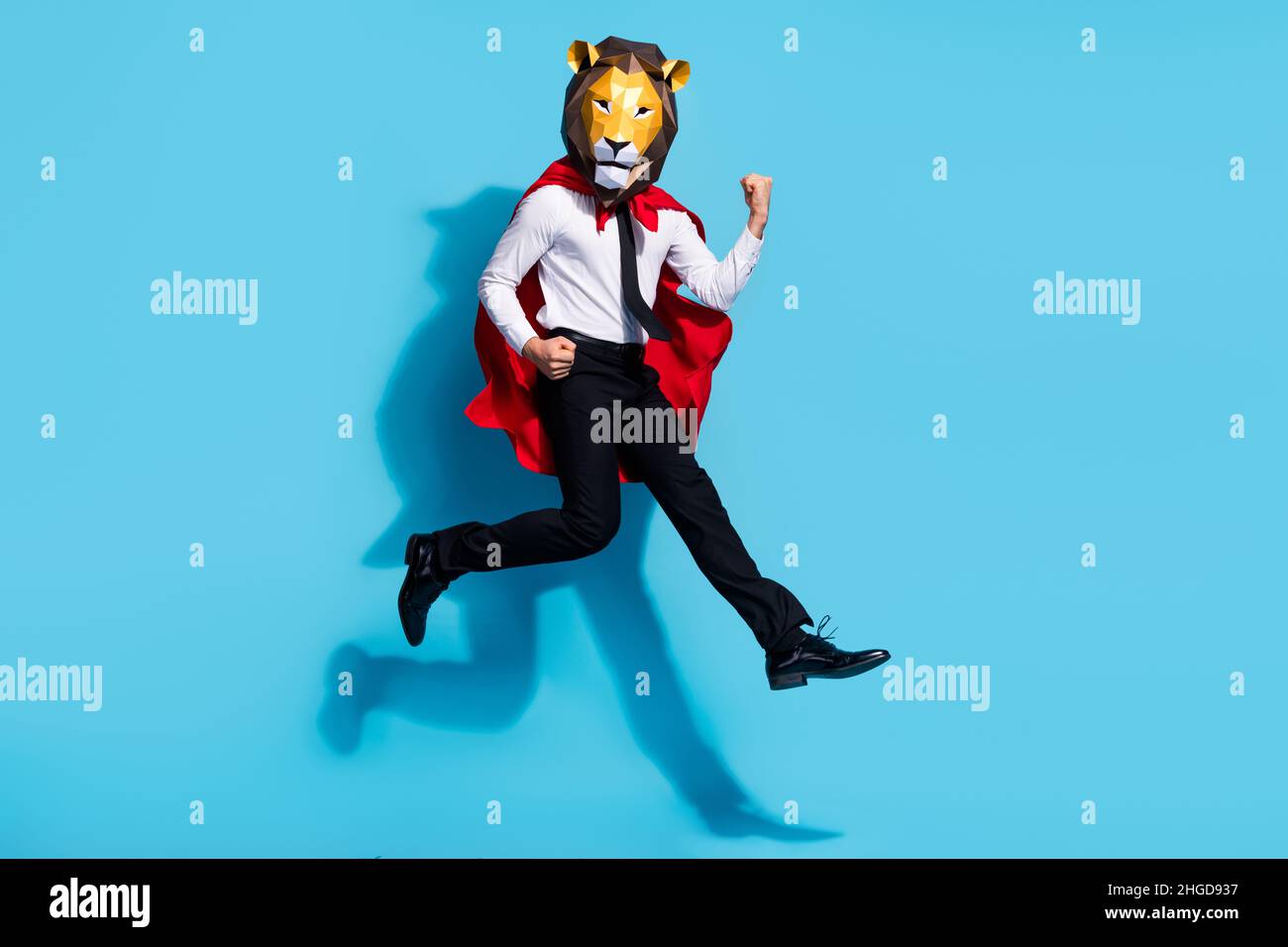 Full body photo of weird guy lion mask jump raise fists up rejoice goal ...