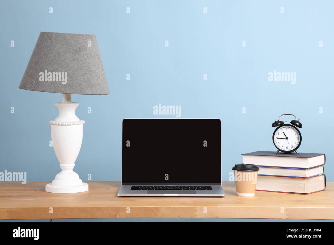 The picture of laptop setting on the desk with color background Stock ...