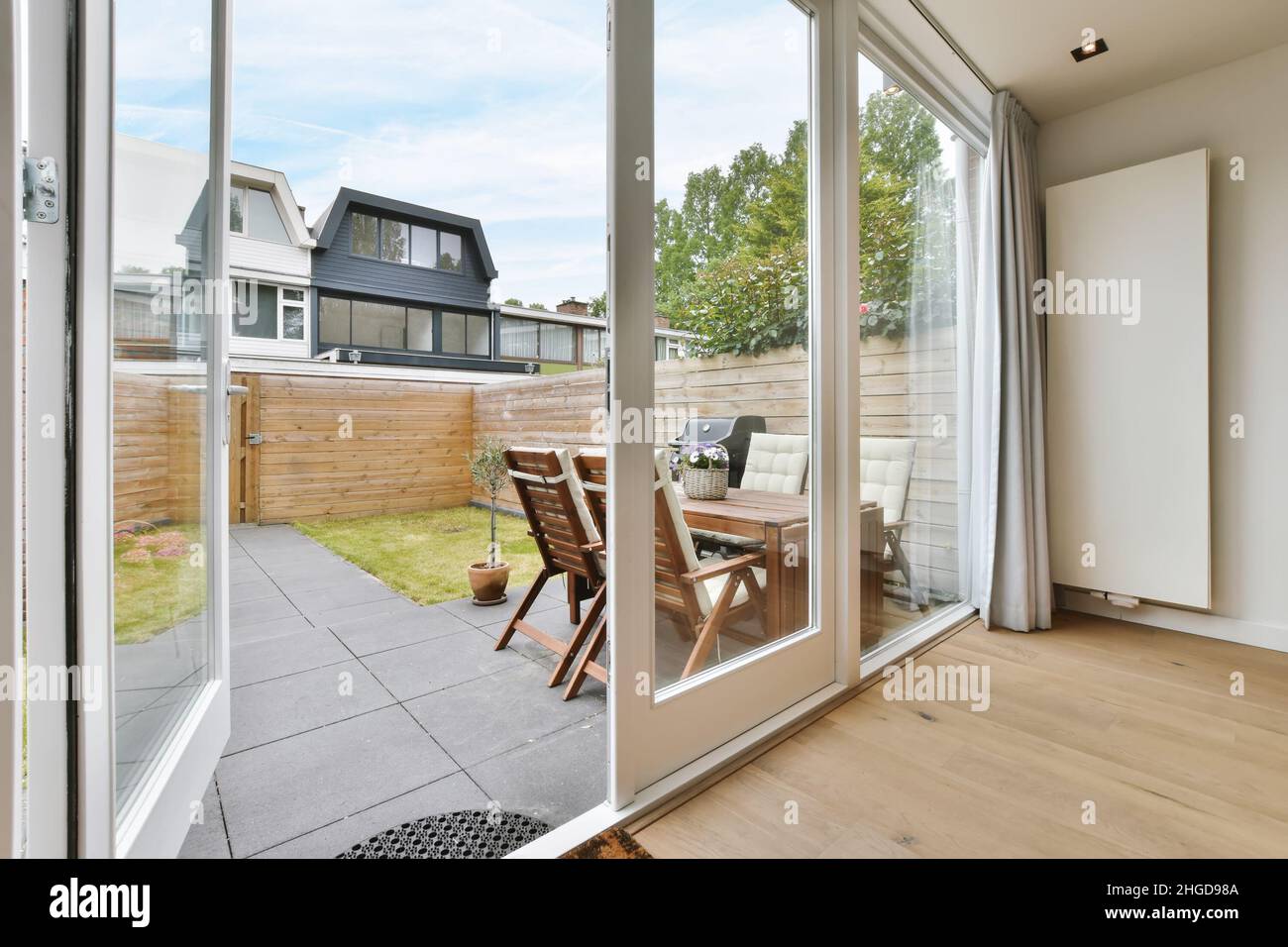 A lovely room with an open door leading to the courtyard Stock Photo ...