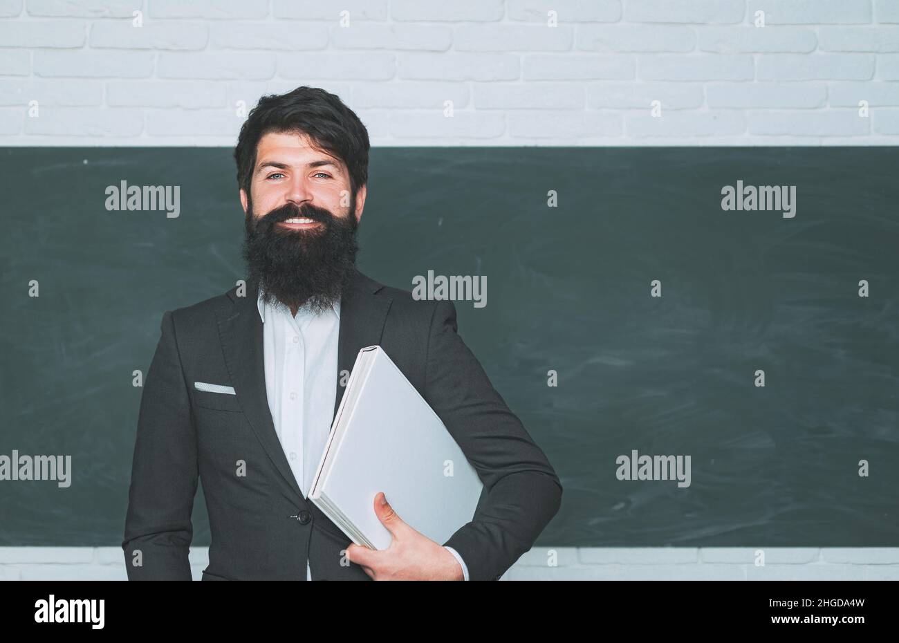 Tutoring. Back to school and happy time. Bearded professor at school ...