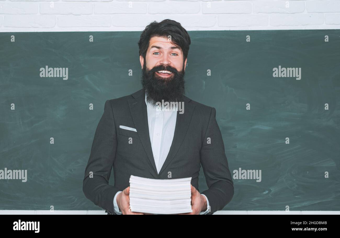 Teachers day - knowledge and educational school concept. Teacher is ...