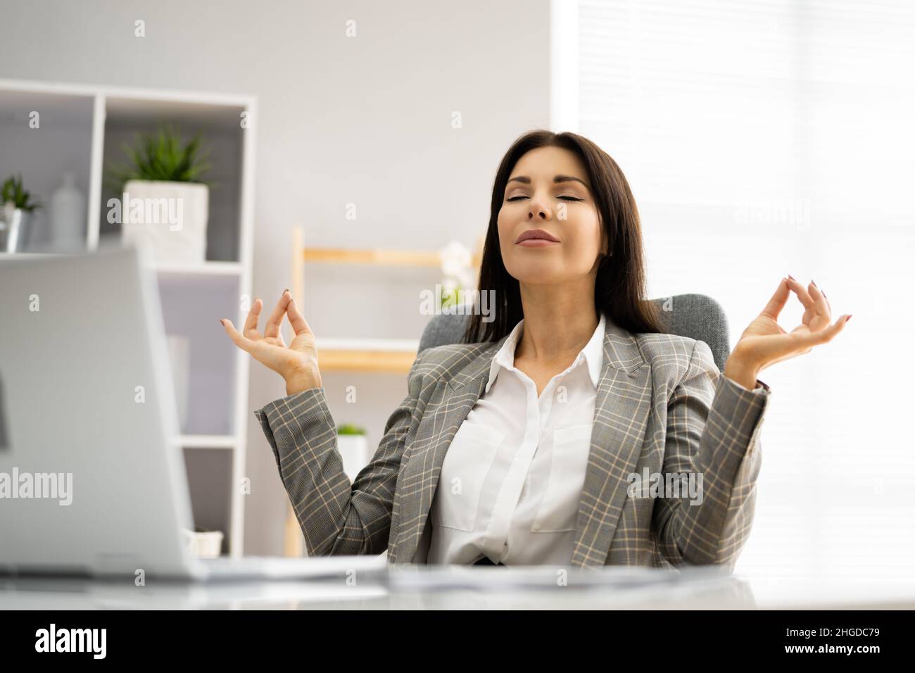 Healthy Yoga Meditation Exercise In Office Chair At Workplace Stock ...