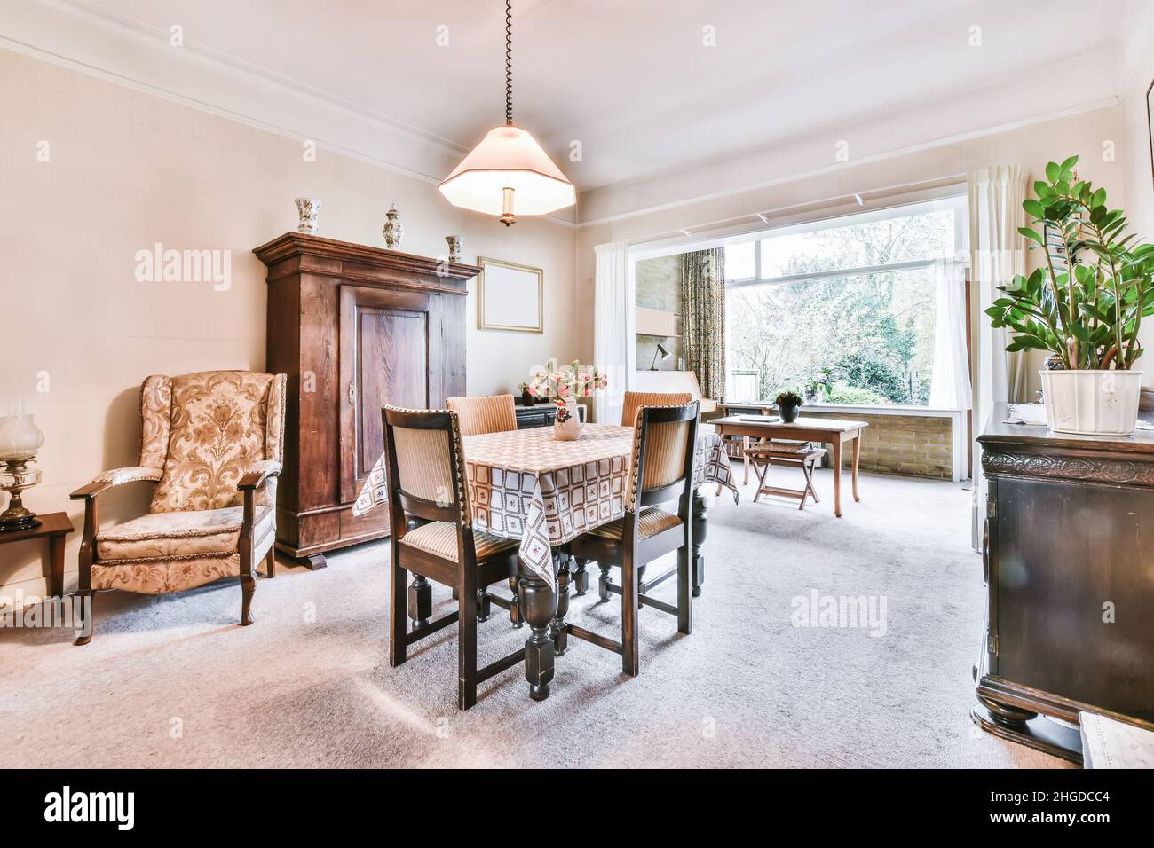 An amazing dining room with a table for four and a chandelier above it ...