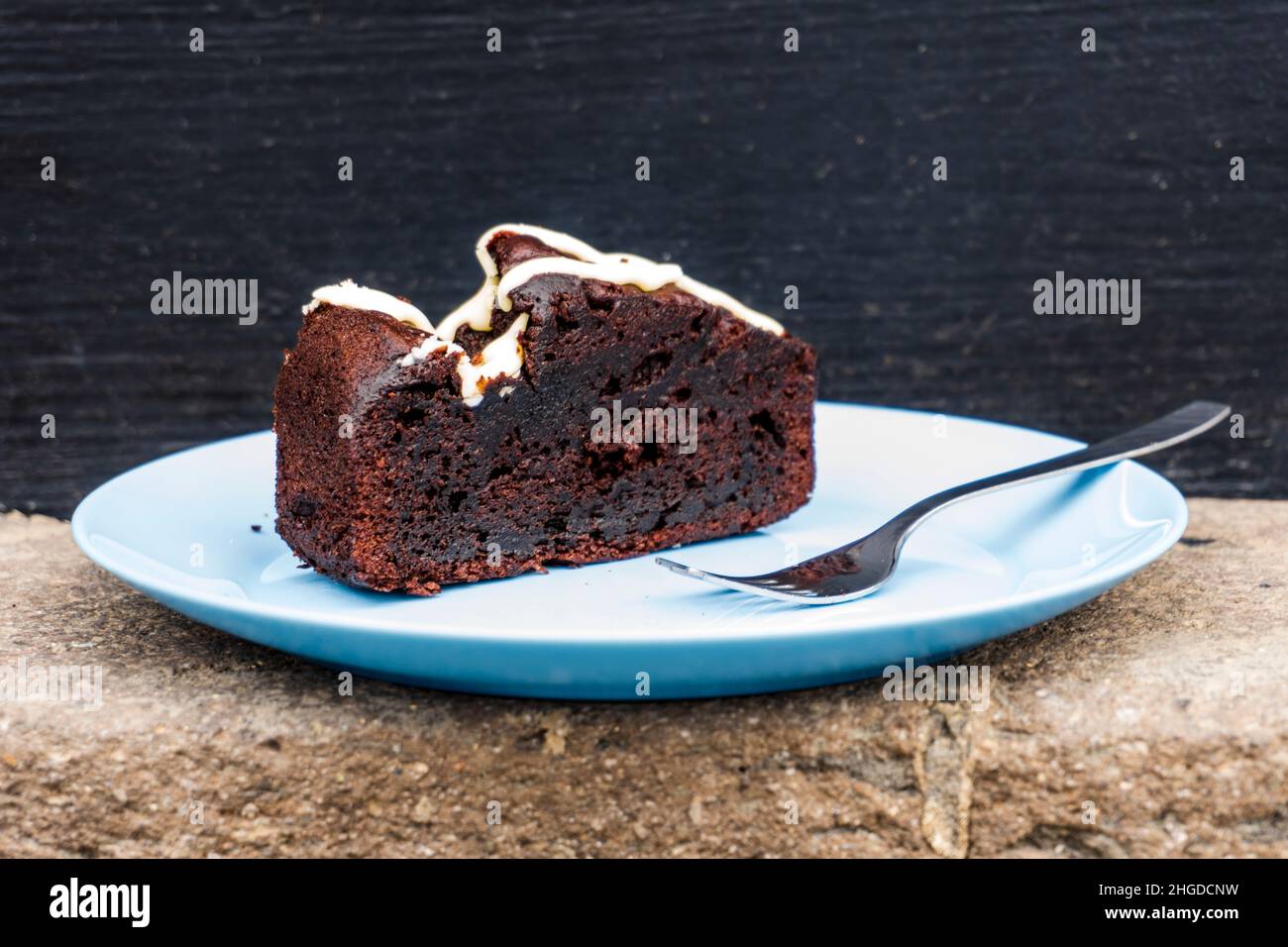 Slice of typical yogurt chocolate cake that looks like brownie, Canary ...