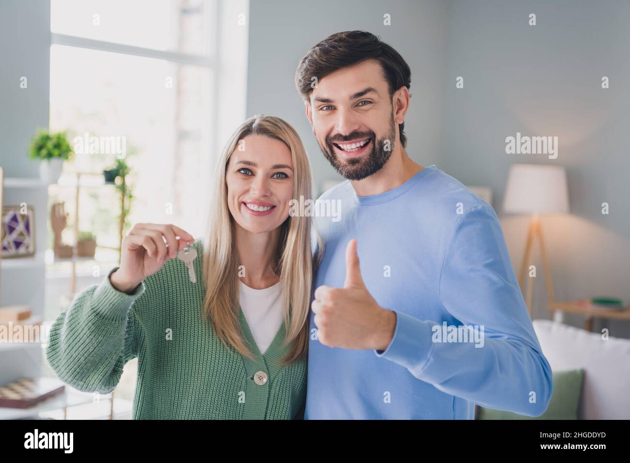 Portrait of two handsome beautiful cheerful people partners holding in ...