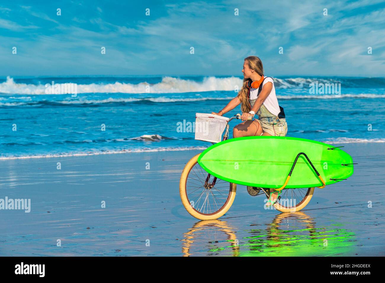 Surfer riding bicycle hi-res stock photography and images - Alamy