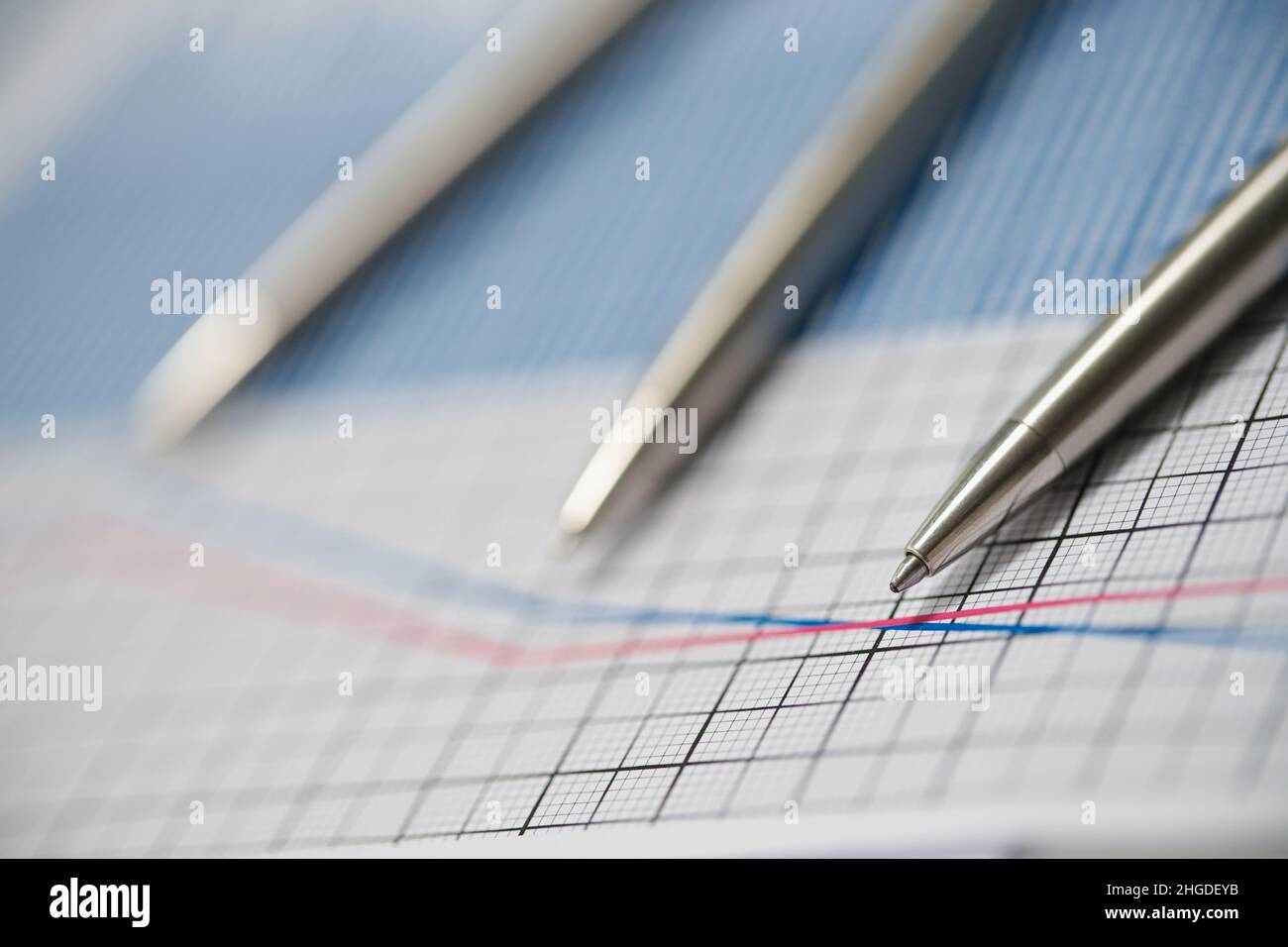 Business paper with graphic, blue and red line in increase and decrease ...