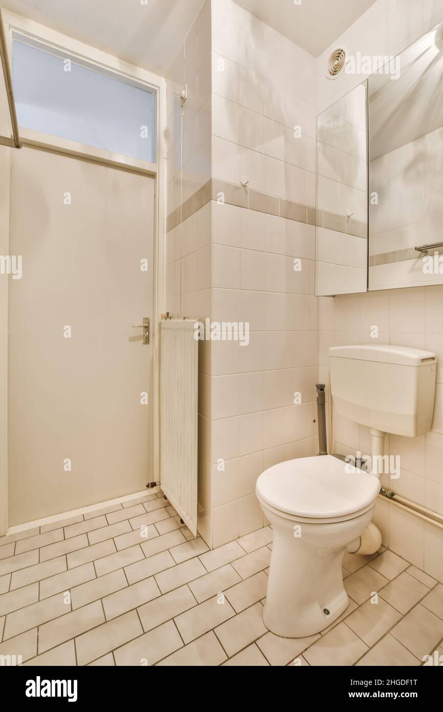 Interior of small clean restroom in miniature style Stock Photo - Alamy