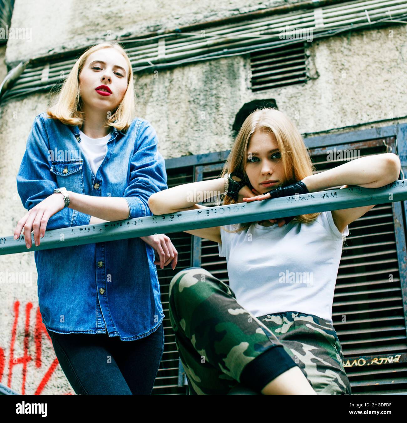 couple of teenage girls ouyside on streets chilling, lifestyle people ...