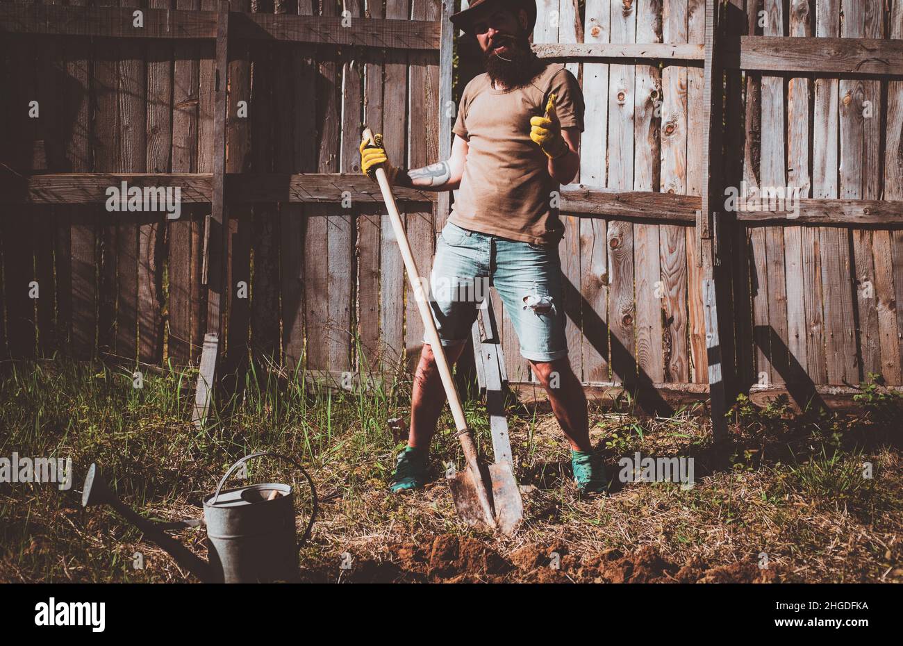 Western cowboy portrait. Full body portrait of funny farmer having fun ...