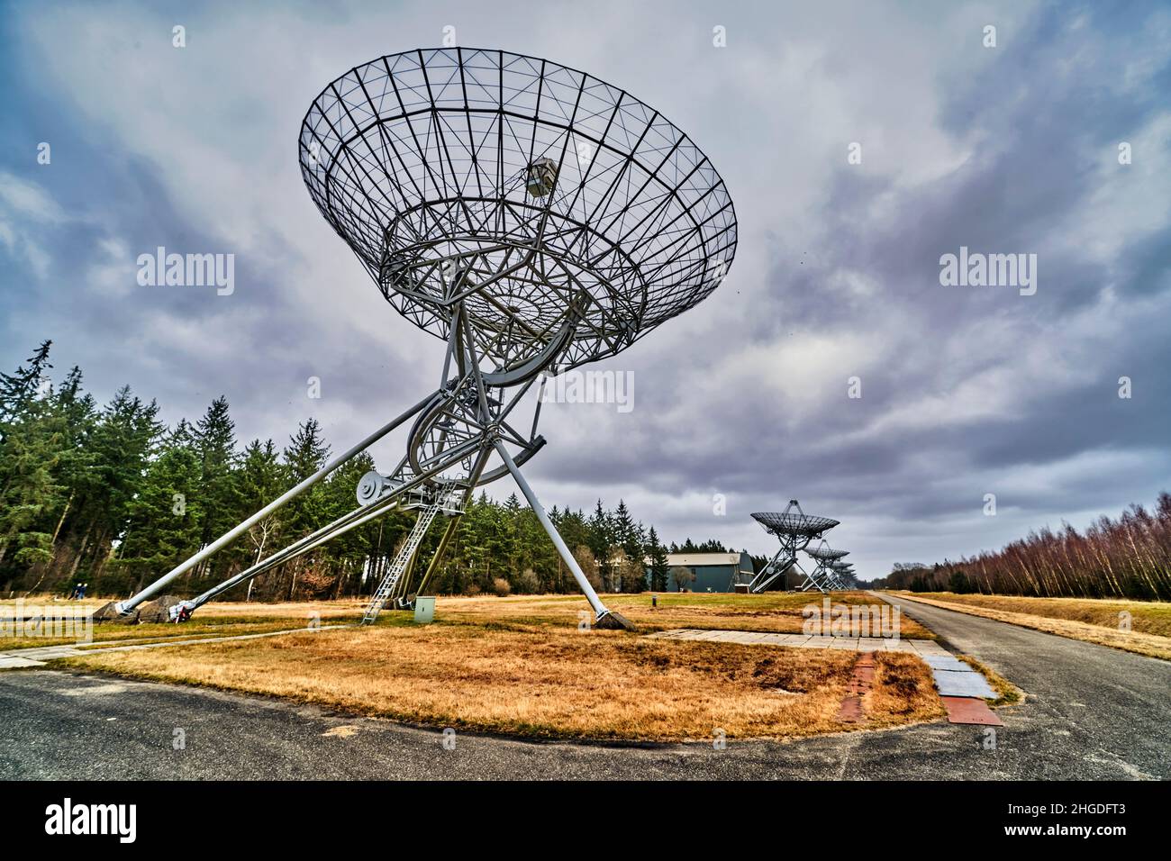 outer space radio telescope array, with a forrest in the background ...
