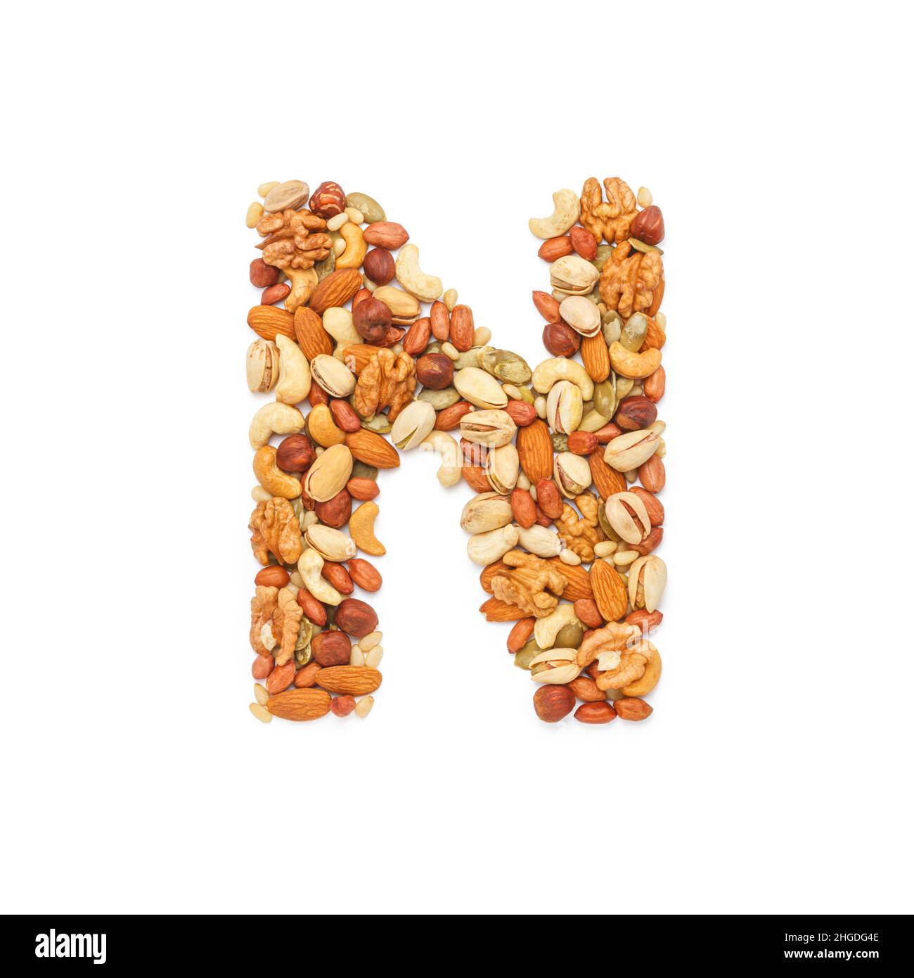 Letter N which is laid out from different nuts, isolated on white ...