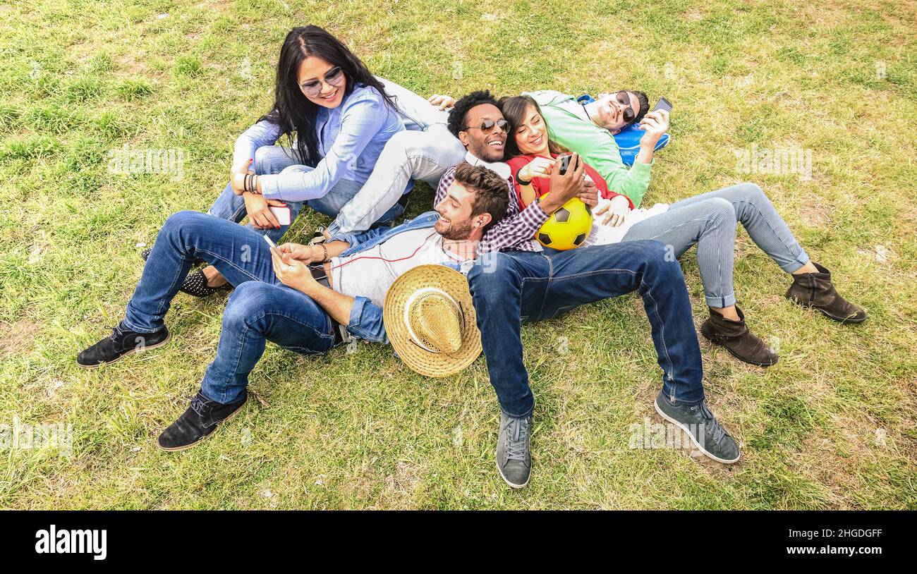 Multiracial best friends having fun at meadow picnic - Happy friendship ...