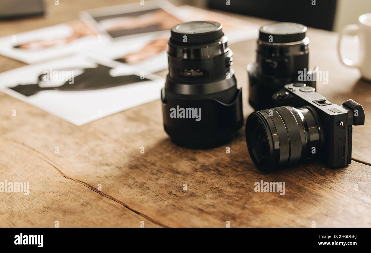 DSLR camera placed on a photographer's desk. Still life shot of a ...