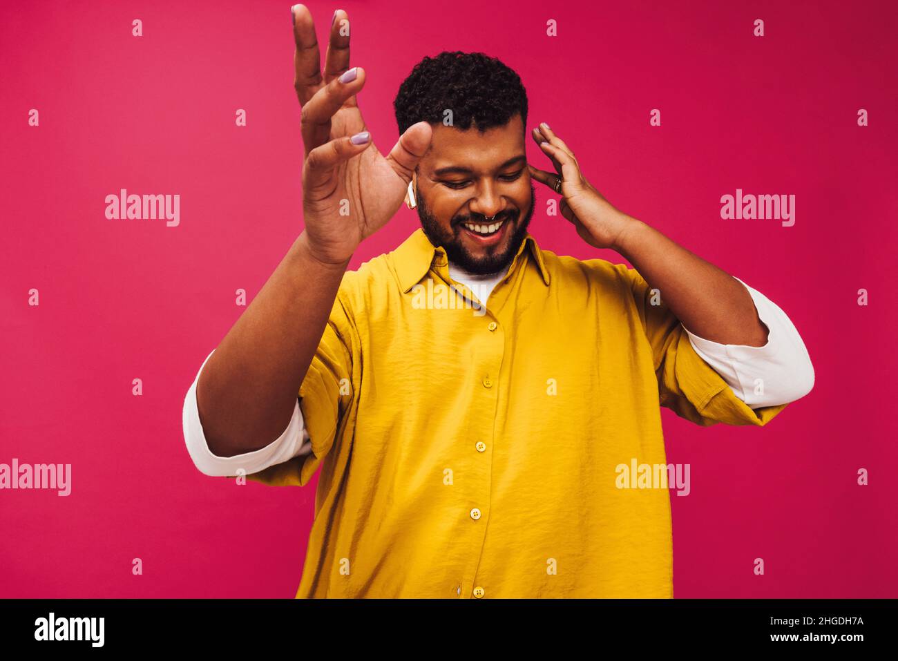 Streaming trendy music in the studio. Happy young man dancing ...