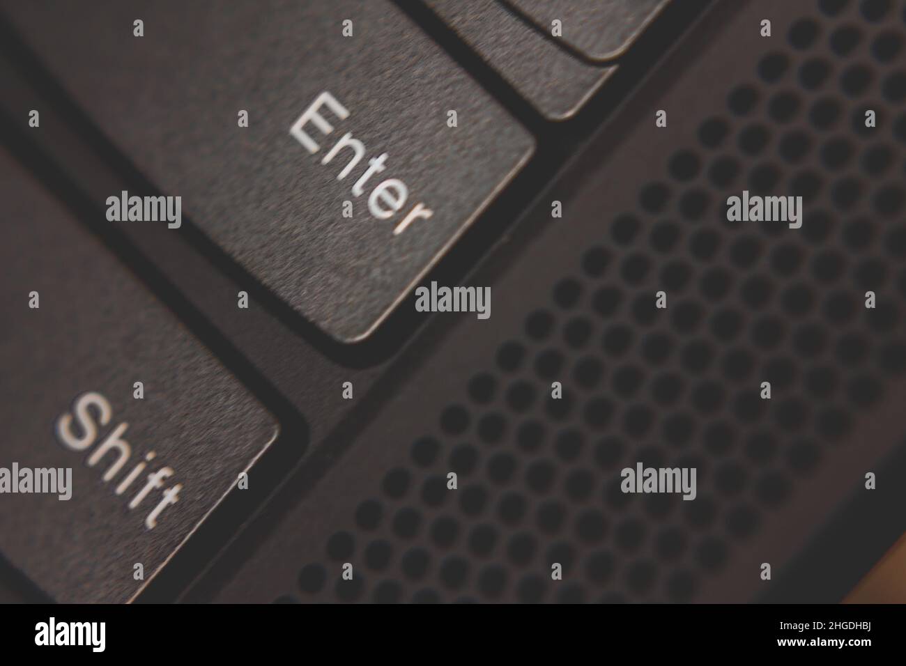 Close up shot of the enter key on a laptop computer Stock Photo - Alamy