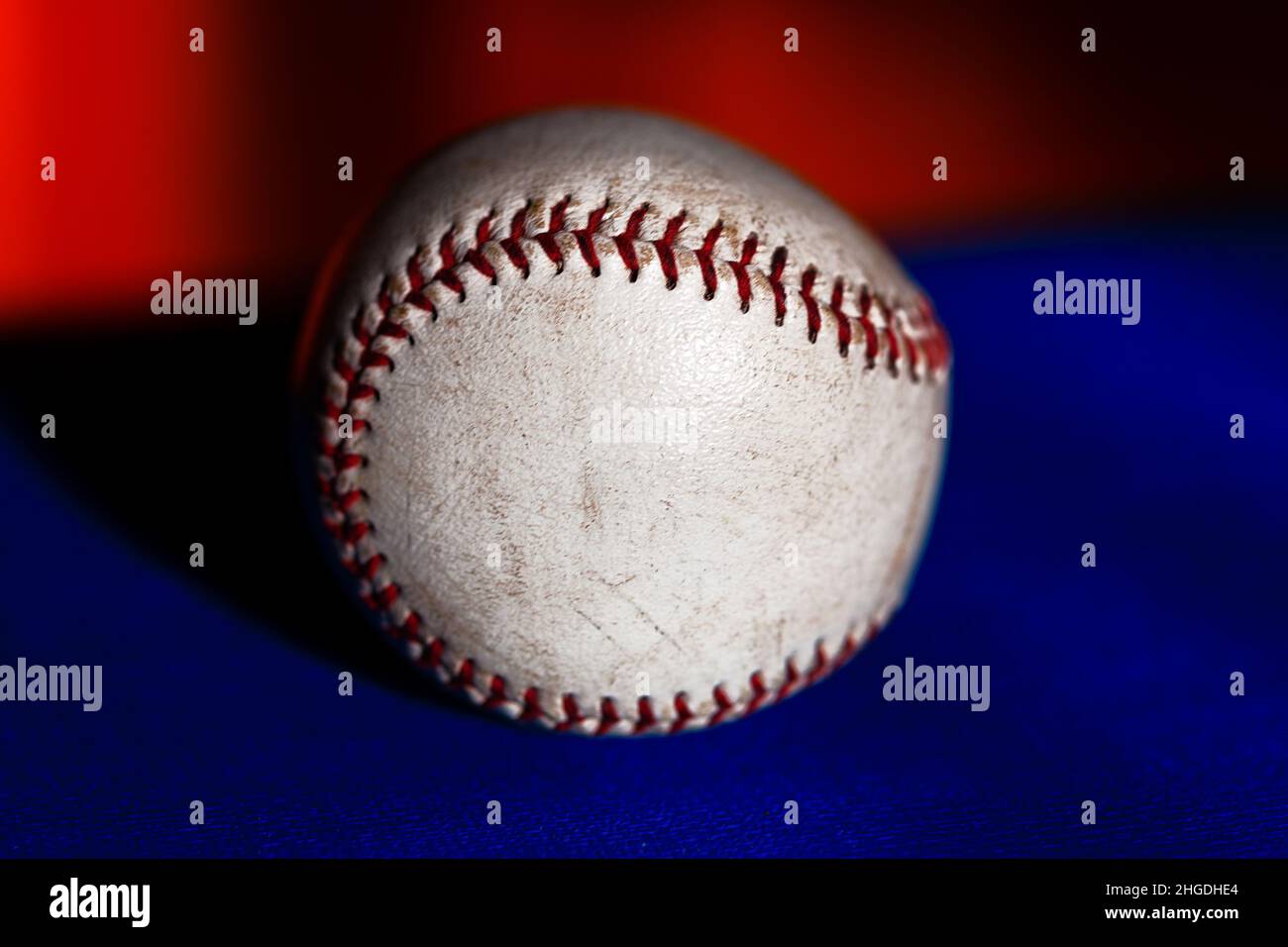 Baseball ball . Blue and red background . Sports leather ball sewn with ...
