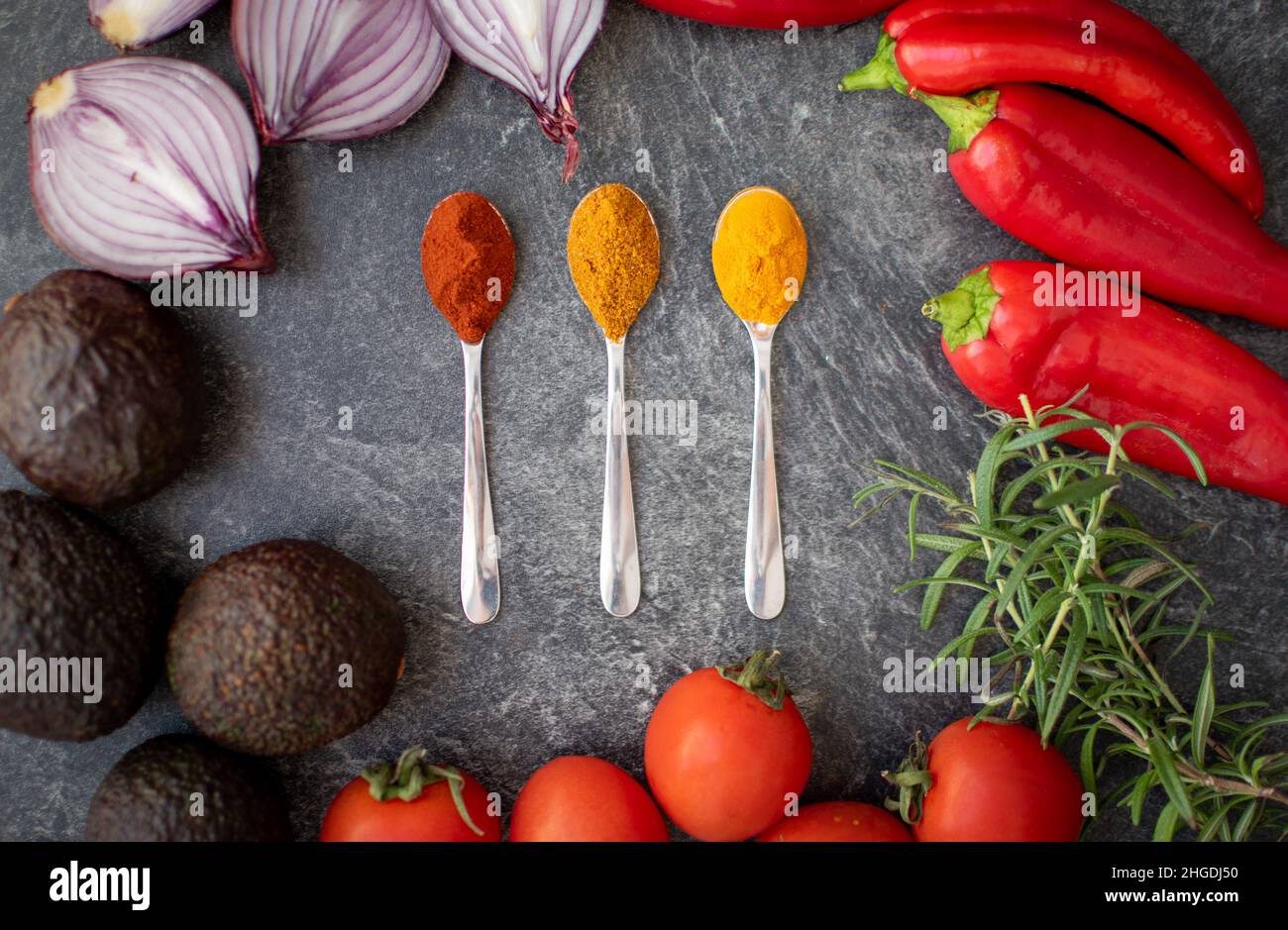 Fresh vegetables and spices in the kitchen ready to be cooked Stock ...