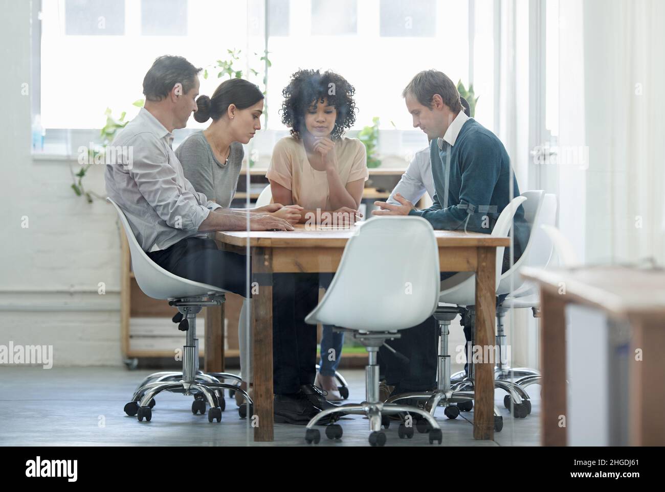 Putting their ideas on the table. Real life businesspeople shot on ...