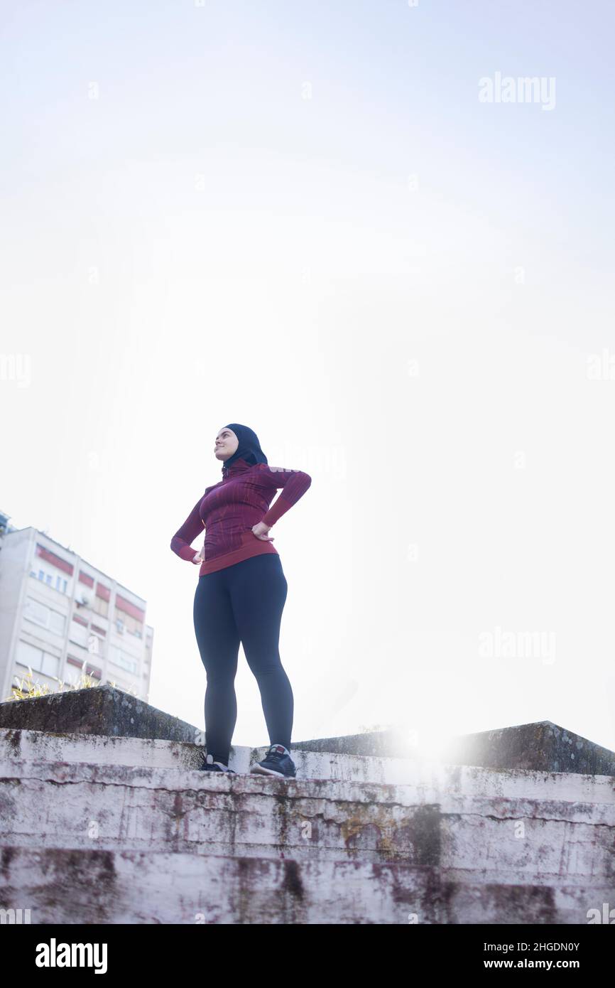 Proud and strong woman standing determined Stock Photo - Alamy