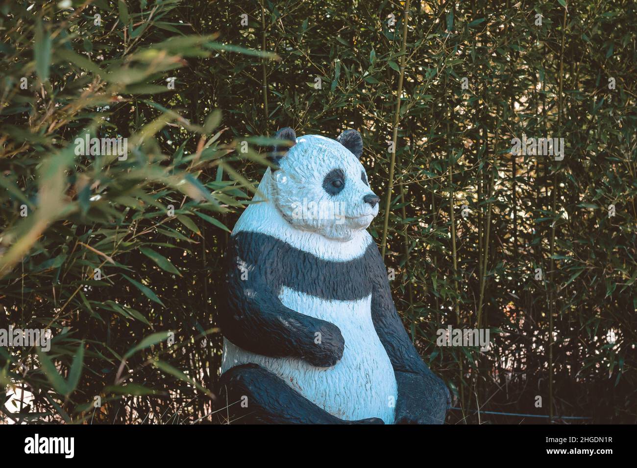 Panda statue in a garden Stock Photo - Alamy