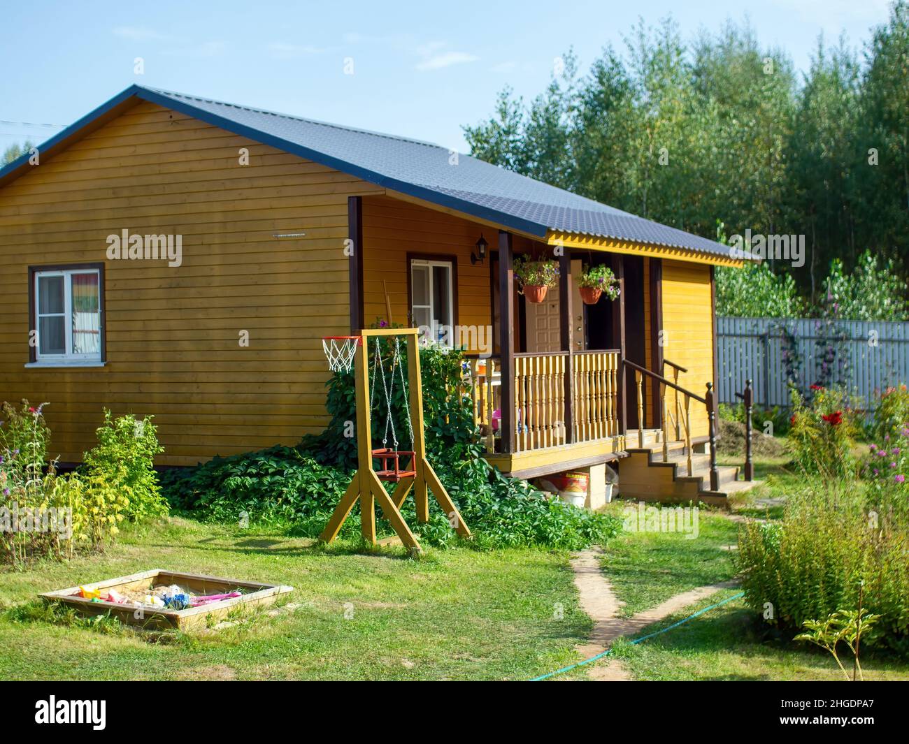 small wooden rural house in the evening Stock Photo - Alamy
