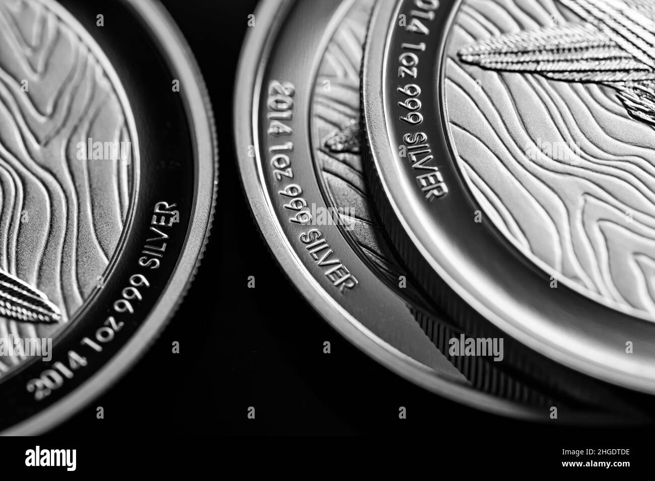 Macro Close up of Silver Bullion Coin on a black mirror background ...