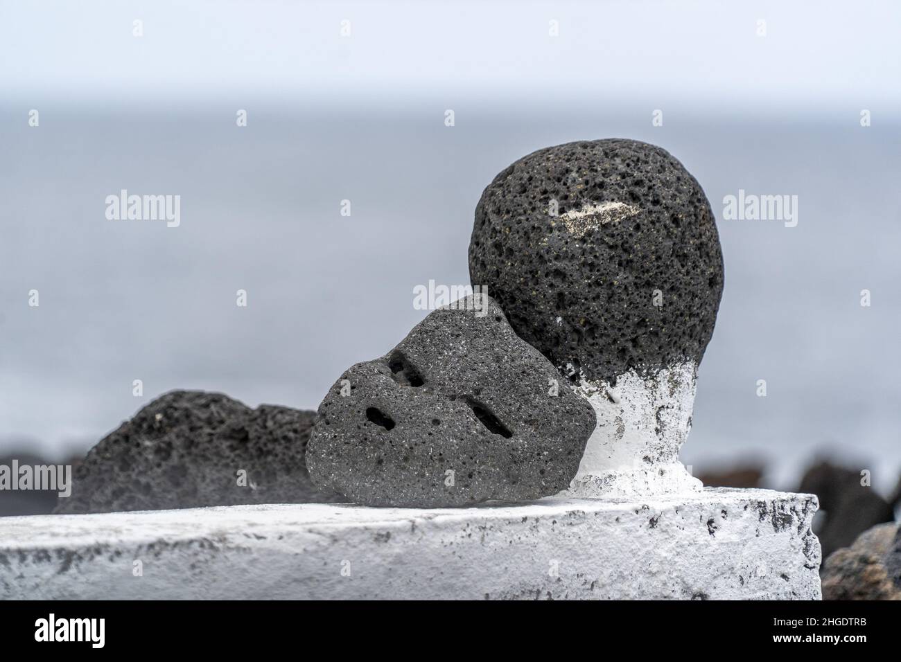 head and mask shape lava rock in Azores Stock Photo - Alamy