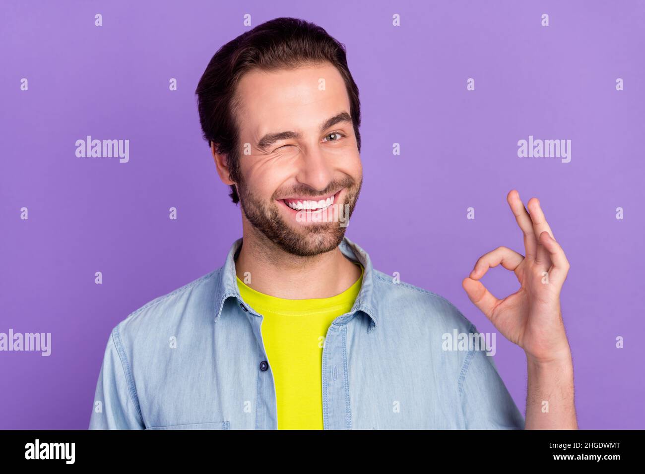 Portrait of cheerful young handsome guy wink eye flirting showing okay ...