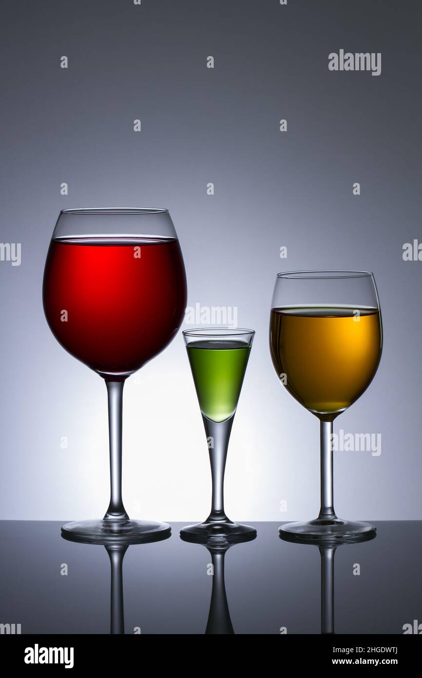 Three Colors of alcohol in glass Stock Photo - Alamy