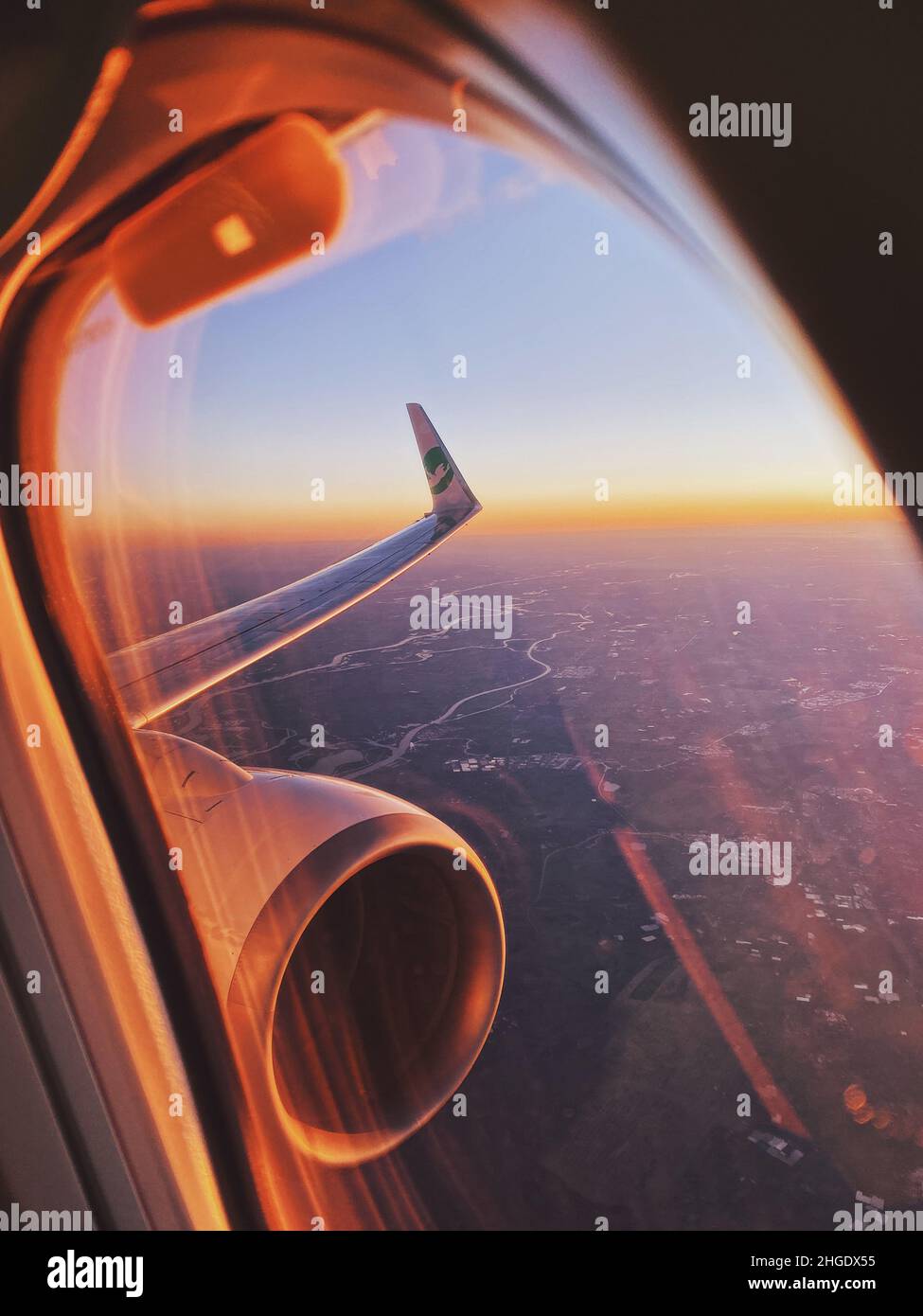 Sunset view from an airplane window Stock Photo - Alamy