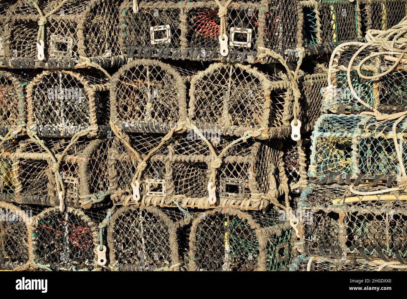 old crab pots are stacked on the pier in Scarborough harbour awaiting ...