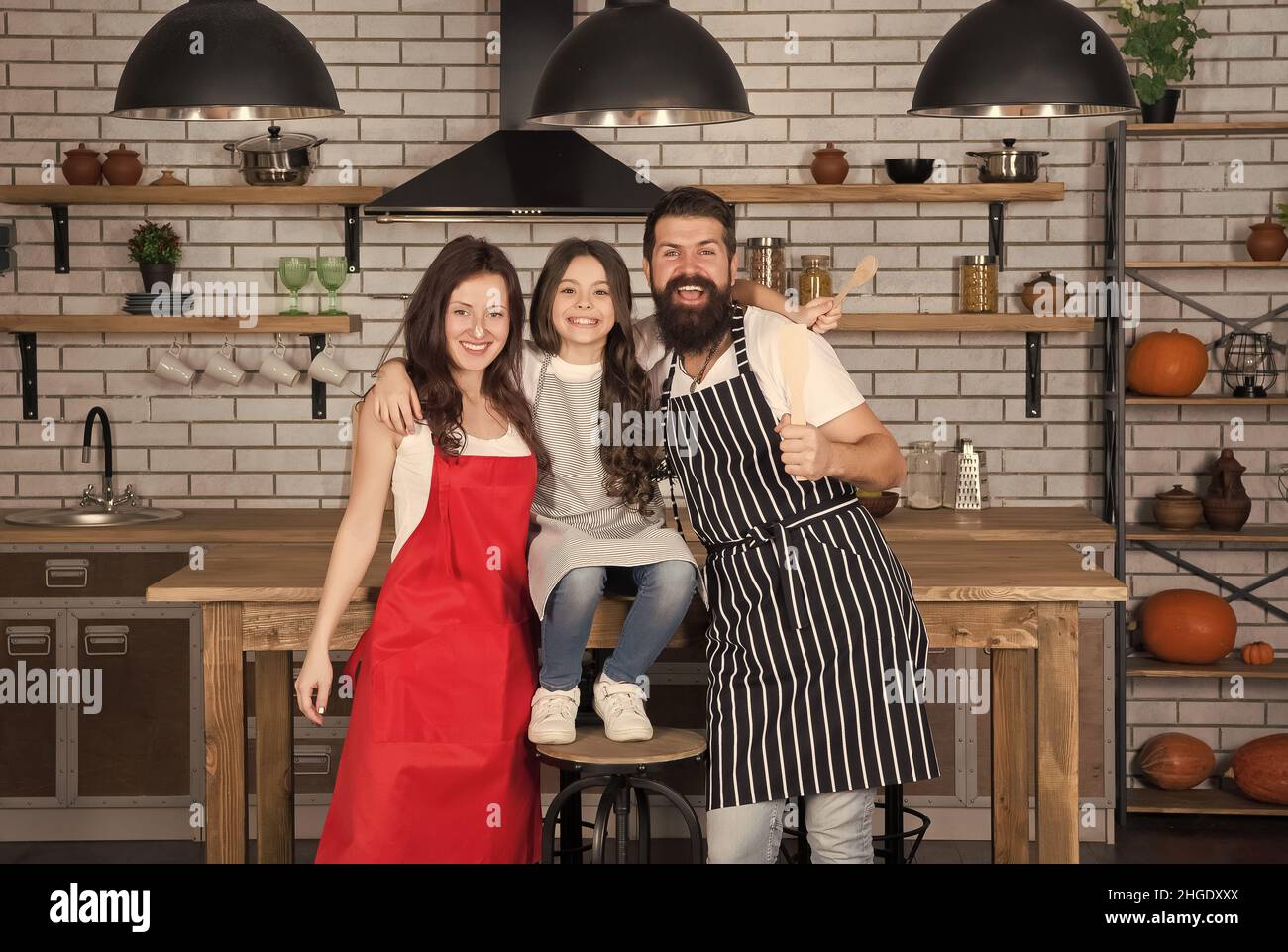 Family holidays. Mother father and daughter cooking together. Happy ...
