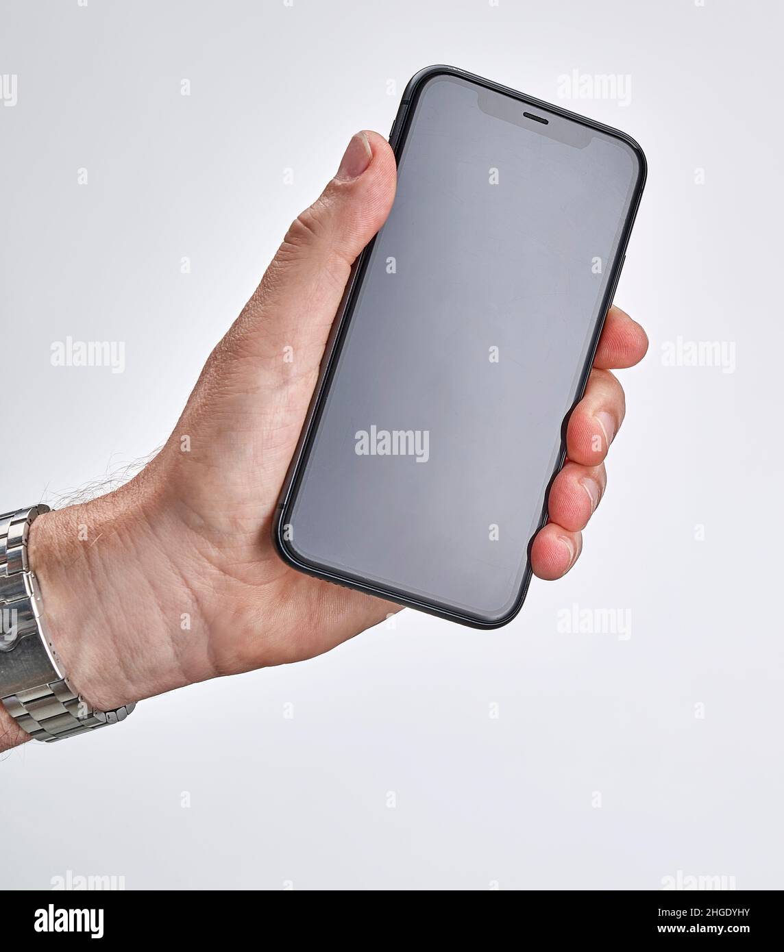 hand holding telephone isolated on white Stock Photo - Alamy