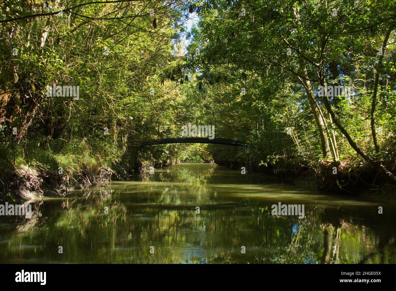 Bridge over the water channel in Park Marais Poitevin near Maillezais ...