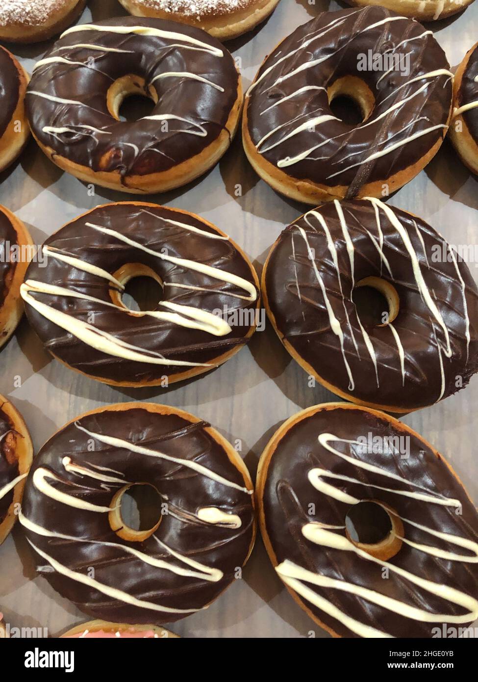 Donuts in rows Stock Photo - Alamy