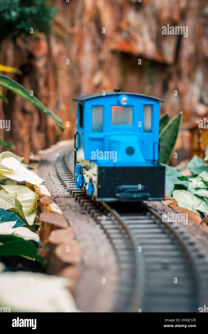 Blue model train on a track in a holiday display in the gardens Stock ...