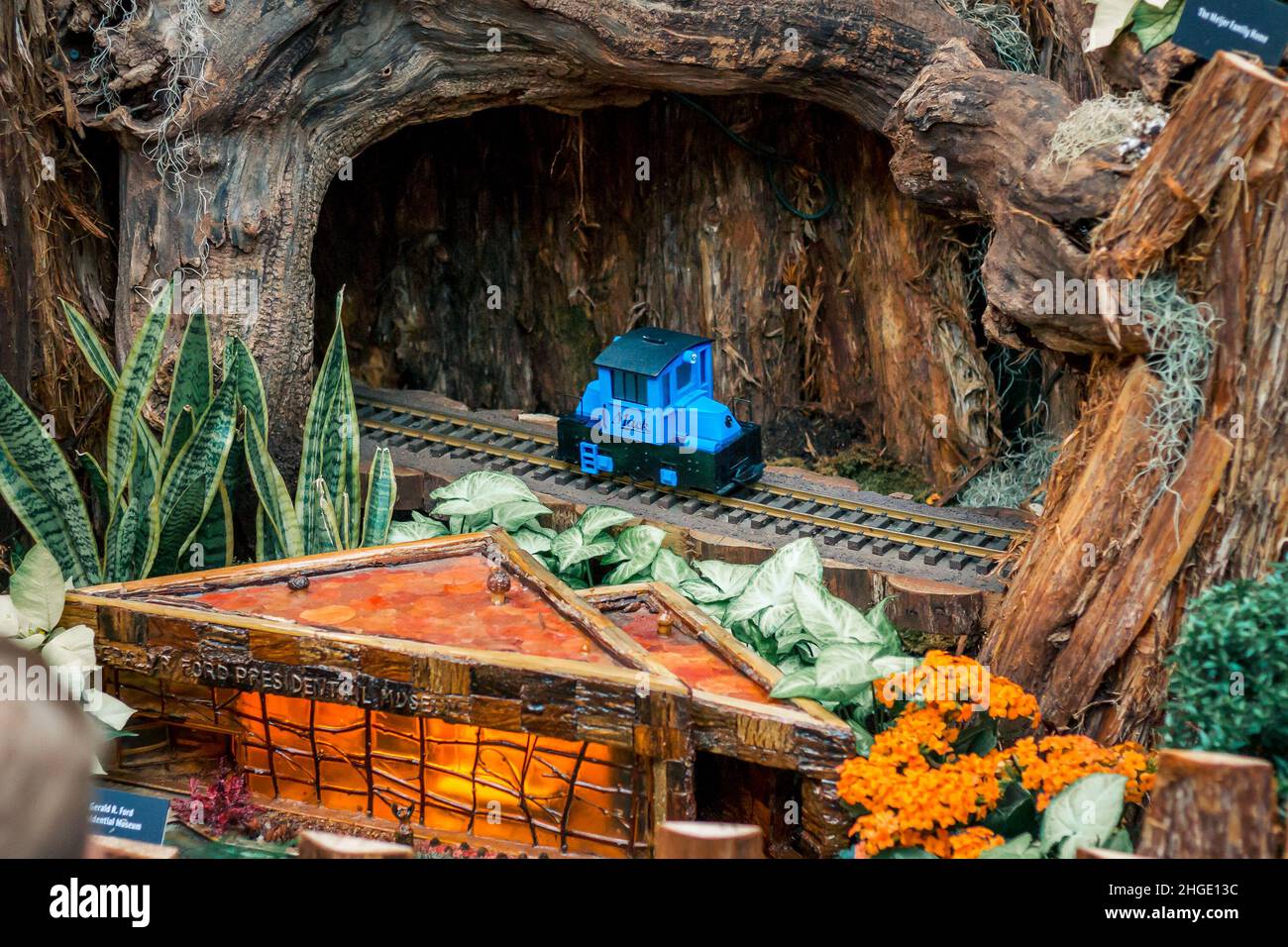 Blue model train running through a city in a train display Stock Photo ...