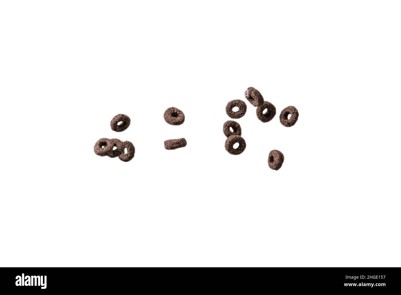 Chocolate rings cereal spill out into a bowl. Breakfast. Isolated on a ...