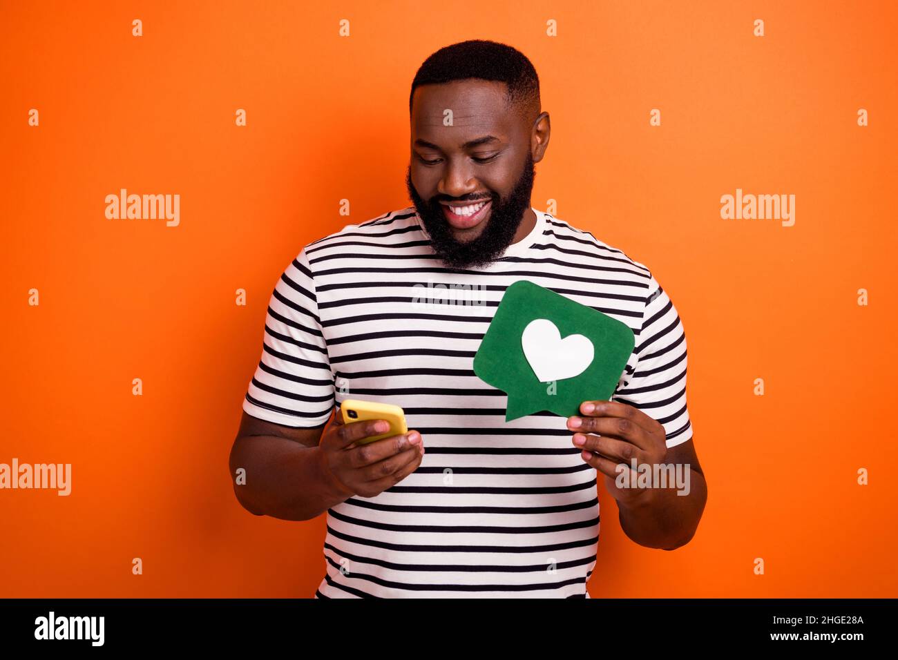 Photo of young african man use mobile click app subscribe user approve ...