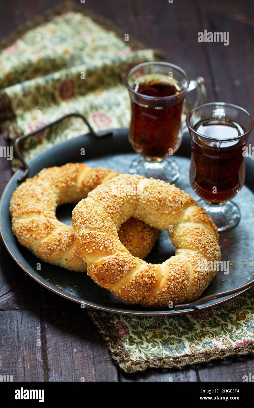 Traditional Turkish simits served with tea. Rustic style Stock Photo ...