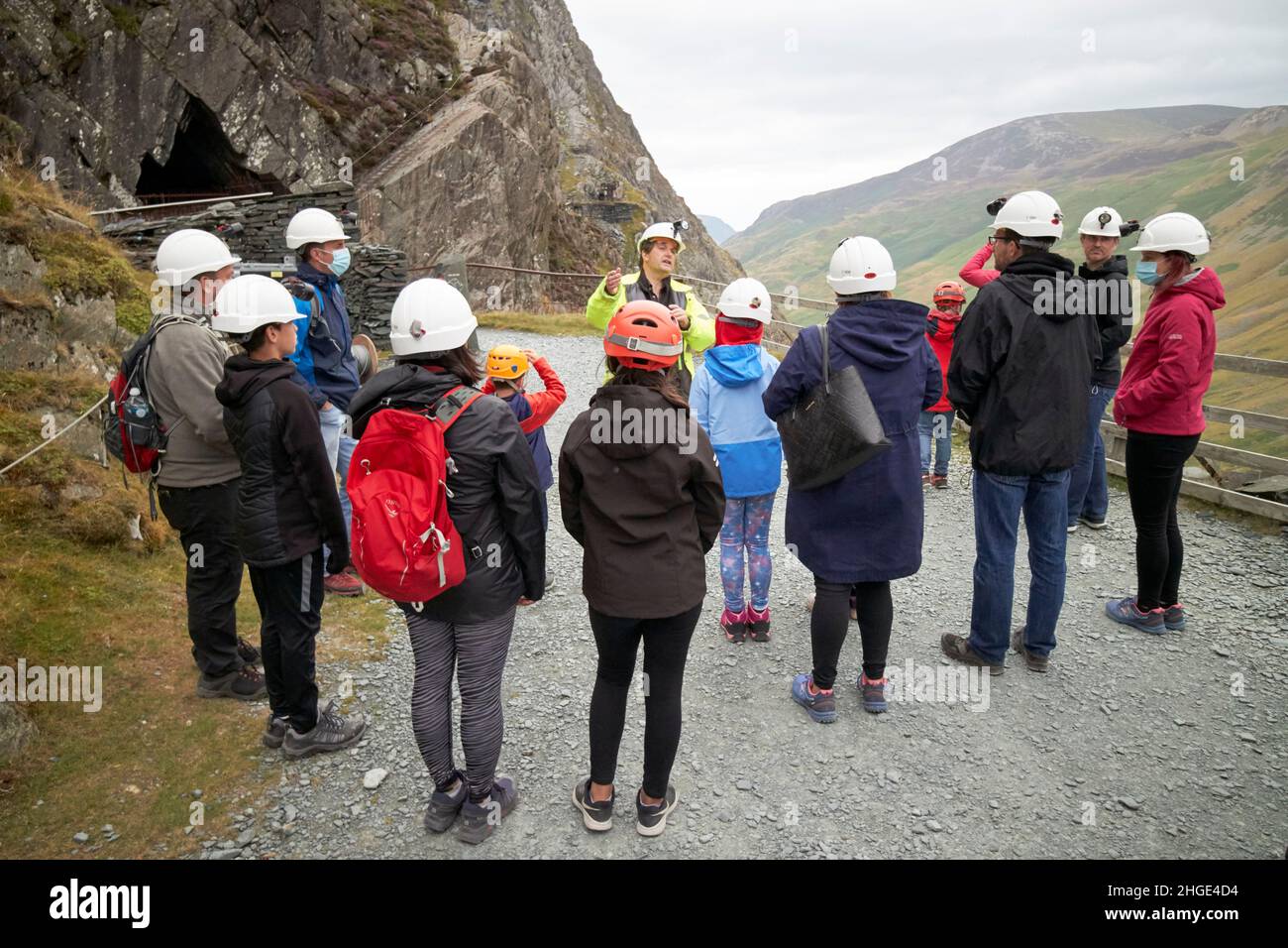 tour guide giving instruction to visitors before entering the honister ...