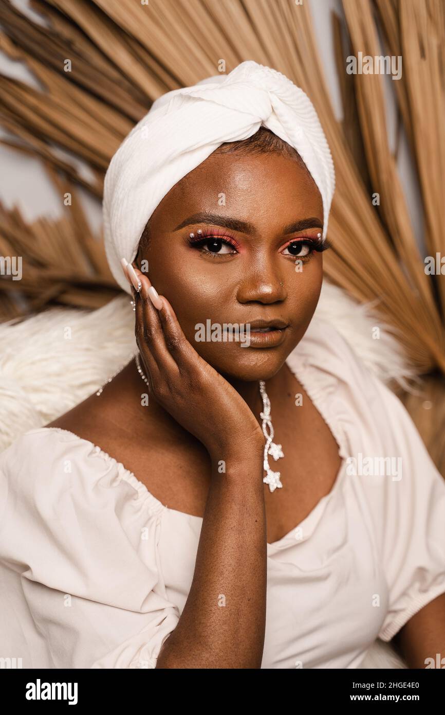 Portrait of black business lady on the dry leaves background. African ...