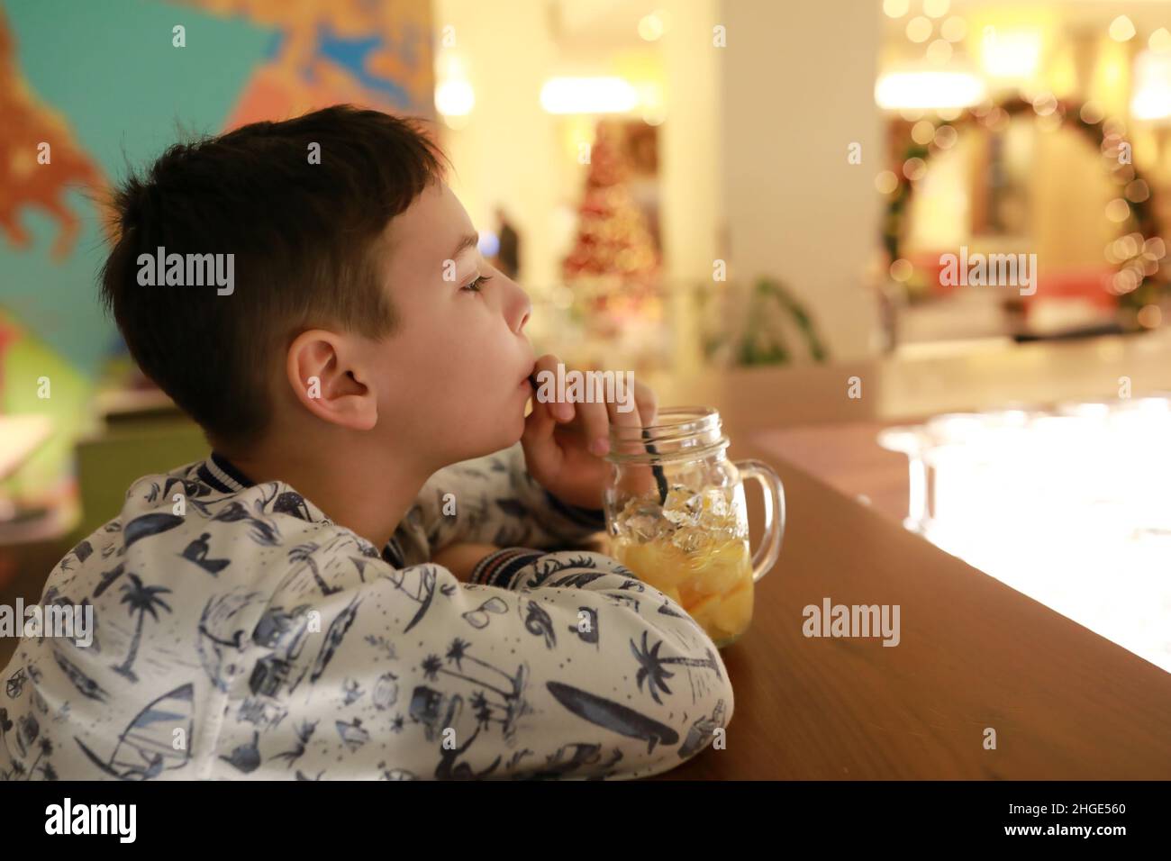 Child has lemonade with ice at bar of restaurant Stock Photo - Alamy