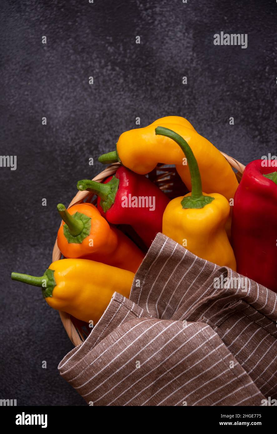 Colorful long sweet peppers on black background Stock Photo - Alamy