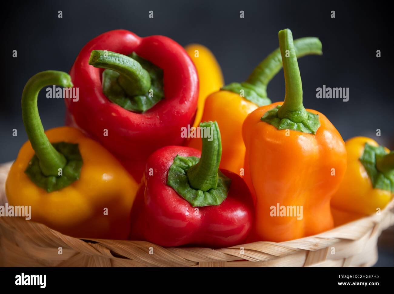Colorful long sweet peppers on black background Stock Photo - Alamy