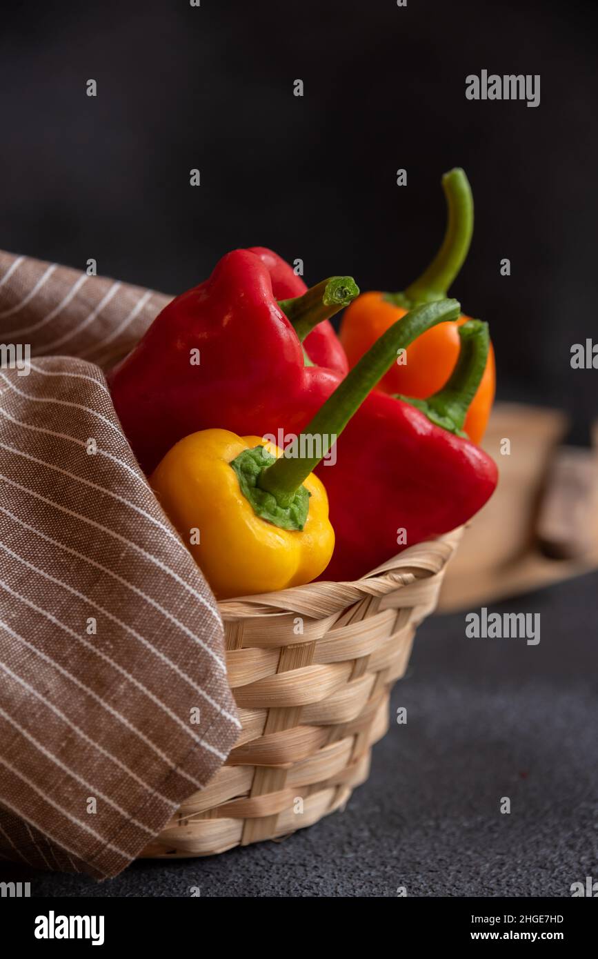Colorful long sweet peppers on black background Stock Photo - Alamy