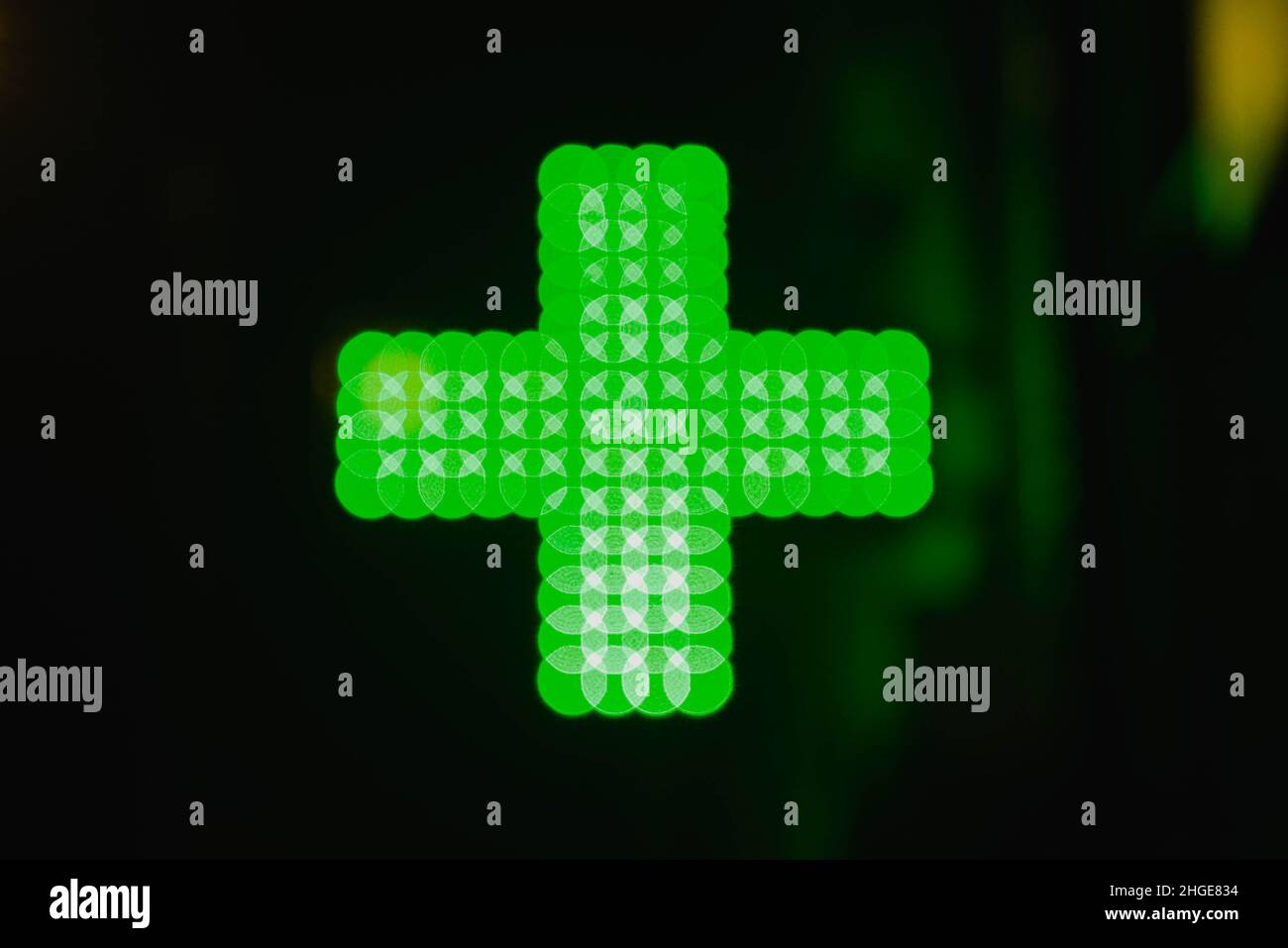 Equal-armed green glowing green cross. It is a symbol and information ...